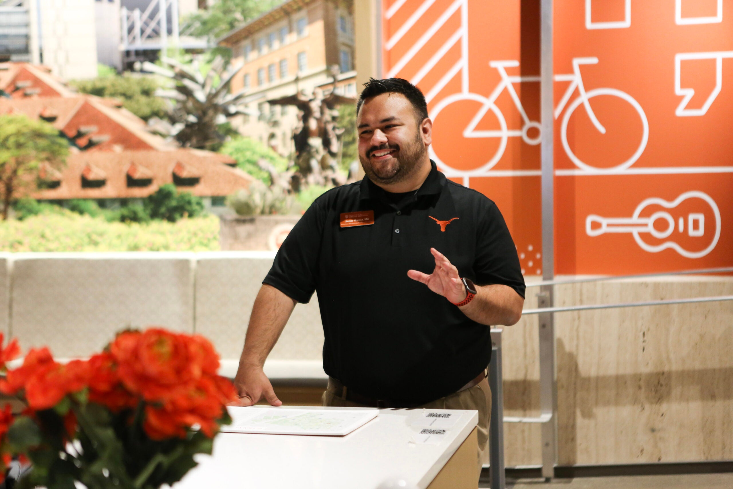The director of the Admissions Welcome Center helps prospective ...